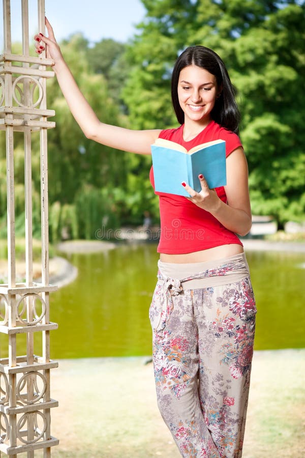 Student Girl Reading Book in Front Lake Stock Image - Image of ...