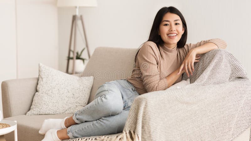 Student Girl Resting on Sofa and Looking at Camera Stock Photo - Image ...
