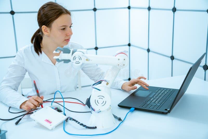 Student Girl Sets Up a Robot Model at the University Laboratory of ...