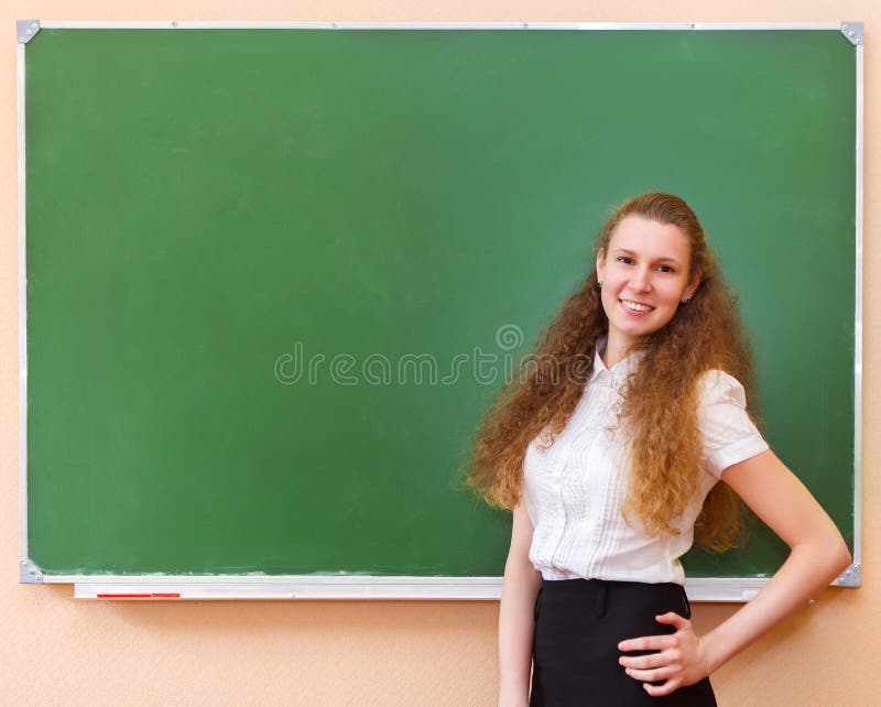 Student Girl Standing Near Clean Blackboard in the Classroom Stock ...