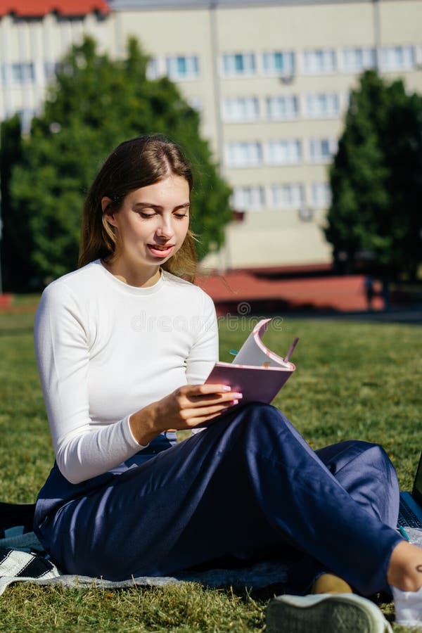 Student Girl is Studying Outside at the Summer Holliday at the ...