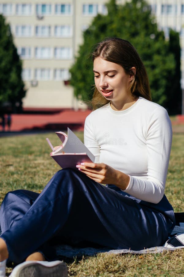 Student Girl is Studying Outside at the Summer Holliday at the ...