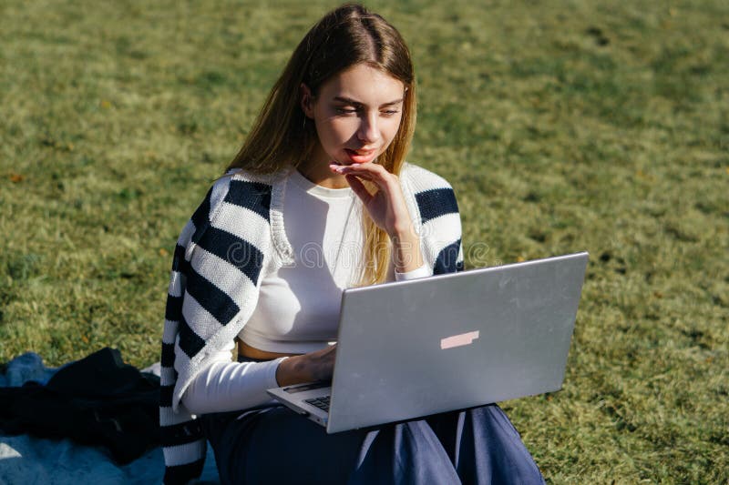 Student Girl is Studying Outside at the Summer Holliday at the ...