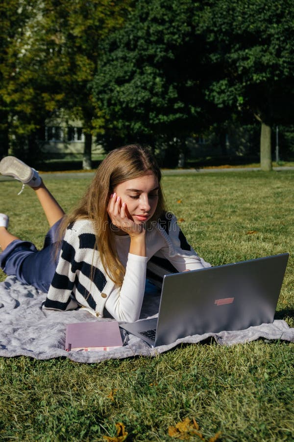 Student Girl is Studying Outside at the Summer Holliday at the ...