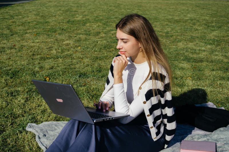 Student Girl is Studying Outside at the Summer Holliday at the ...