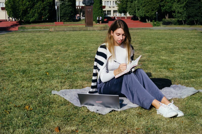 Student Girl is Studying Outside at the Summer Holliday at the ...