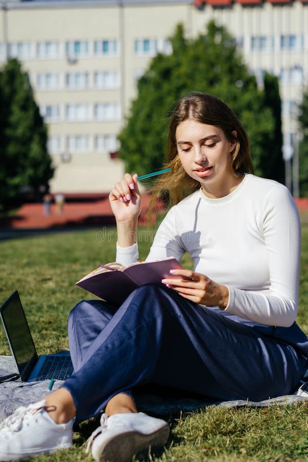 Student Girl is Studying Outside at the Summer Holliday at the ...