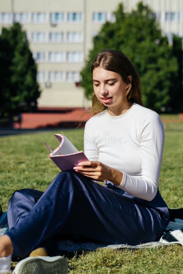 Student Girl is Studying Outside at the Summer Holliday at the ...