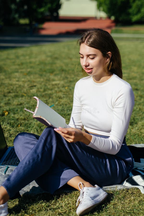Student Girl is Studying Outside at the Summer Holliday at the ...