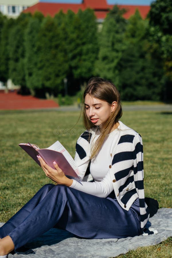 Student Girl is Studying Outside at the Summer Holliday at the ...