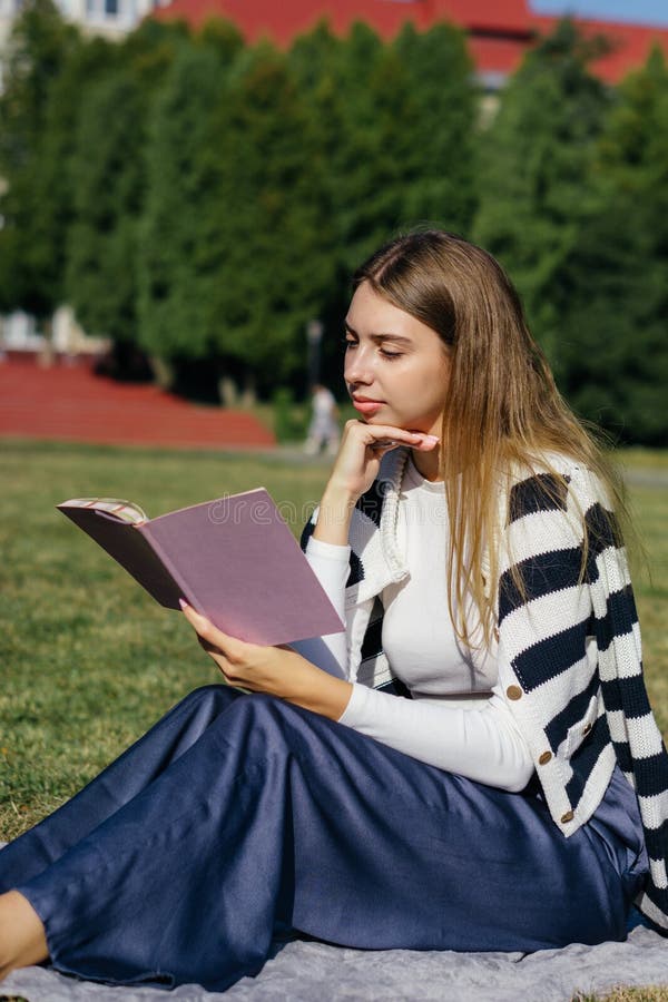 Student Girl is Studying Outside at the Summer Holliday at the ...