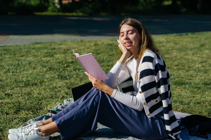 Student Girl is Studying Outside at the Summer Holliday at the ...