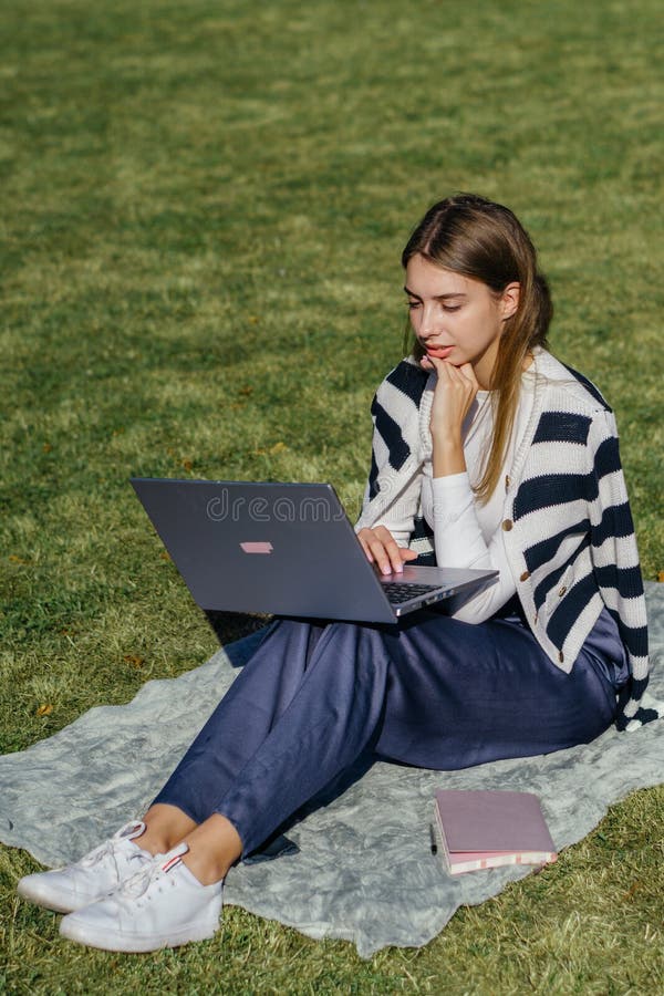 Student Girl is Studying Outside at the Summer Holliday at the ...