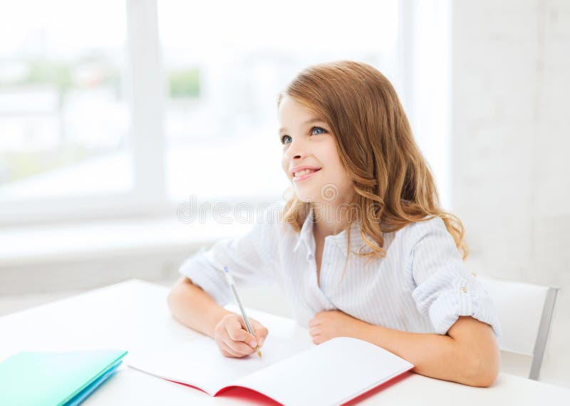 Student Girl Writing in Notebook at School Stock Photo - Image of ...