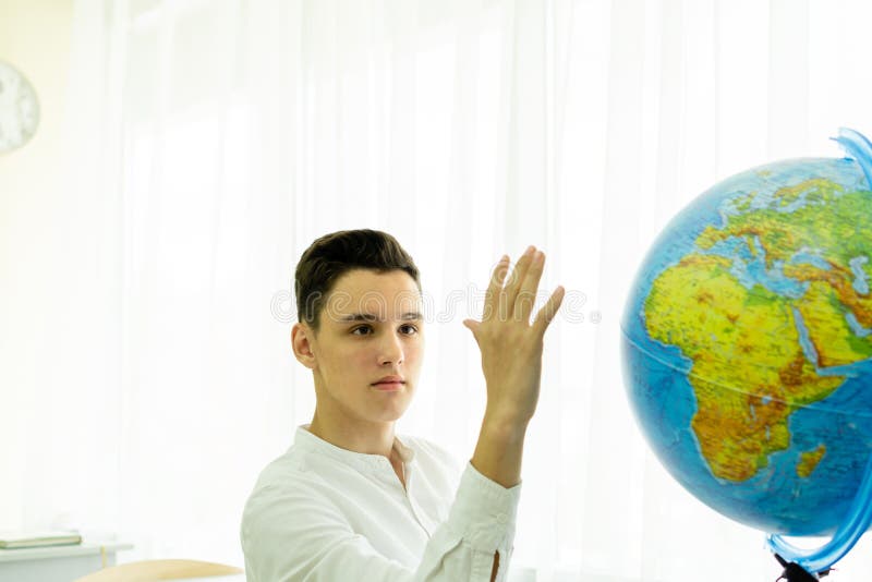 A Student Giving an Answer in Class with His Hand Raised is Sitting at ...