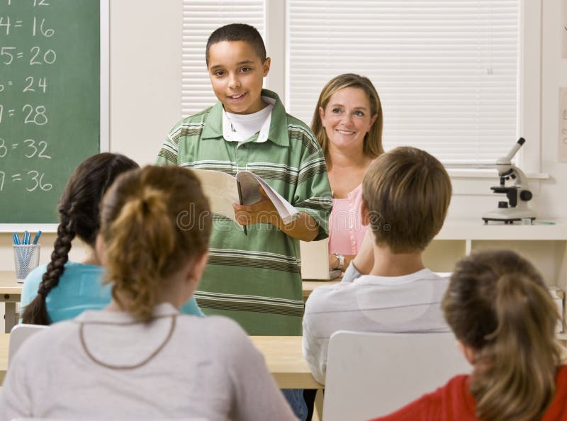 Student Giving Report in Classroom Stock Image - Image of child, smile ...