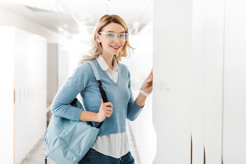 Student in Glasses with Backpack Opening Locker in College Stock Photo ...