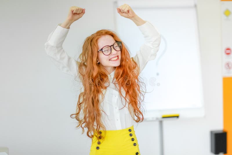 Student with Glasses and Long Red Hair in the Classroom Stock Image ...