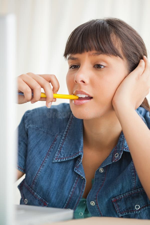 Student Grimacing while Chewing a Pencil Stock Photo - Image of ...