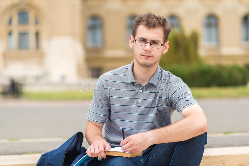 Student guy doing homework stock image. Image of page - 98784203