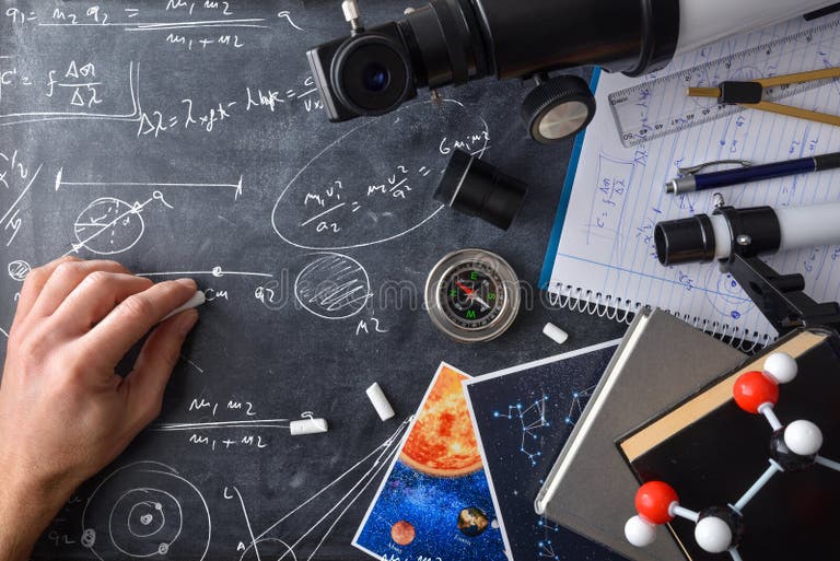Student Hand Doing Astronomical Calculations on Blackboard with ...