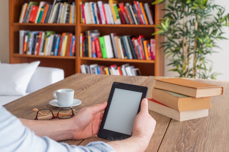 Ebook Reader and Paper Books on Bookshelf Background Stock Image ...