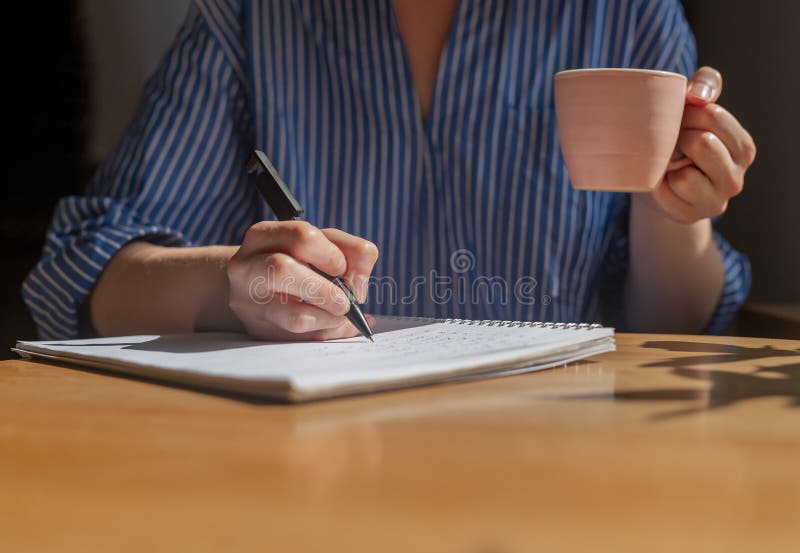 Student Hands Writing with Pen in Notepad, Taking Notes and Holding ...