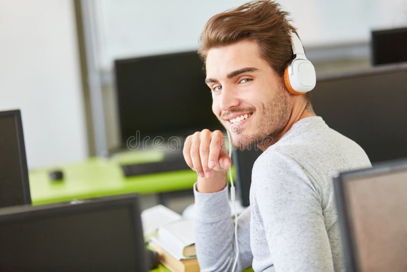 Student with Headphones in Class Stock Photo - Image of computer ...