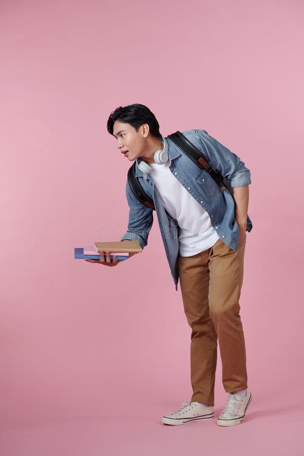 Student with Heavy Book Isolated on Pink Stock Photo - Image of ...