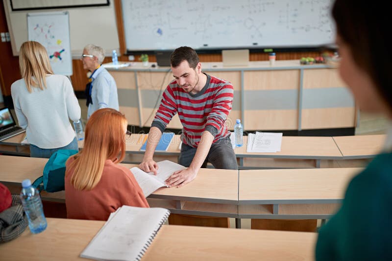 Student Helping Colleague in a Break of a Lecture Stock Image - Image ...