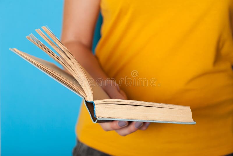 Student Hold Book in Hands and Read Text. Personal Education Stock ...