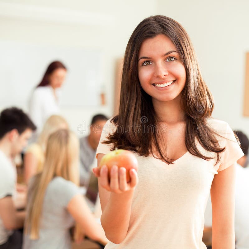 Student Holding an Apple stock image. Image of casual - 30914069