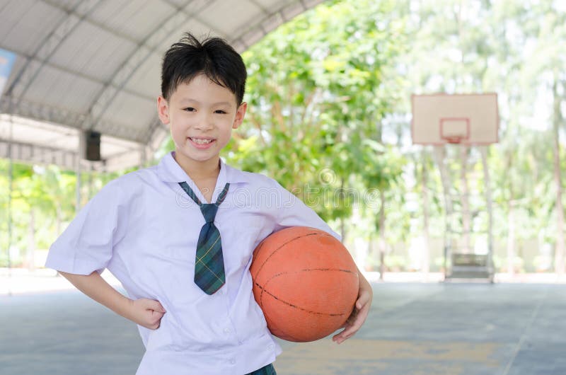 Student holding basketball stock photo. Image of student - 62131284