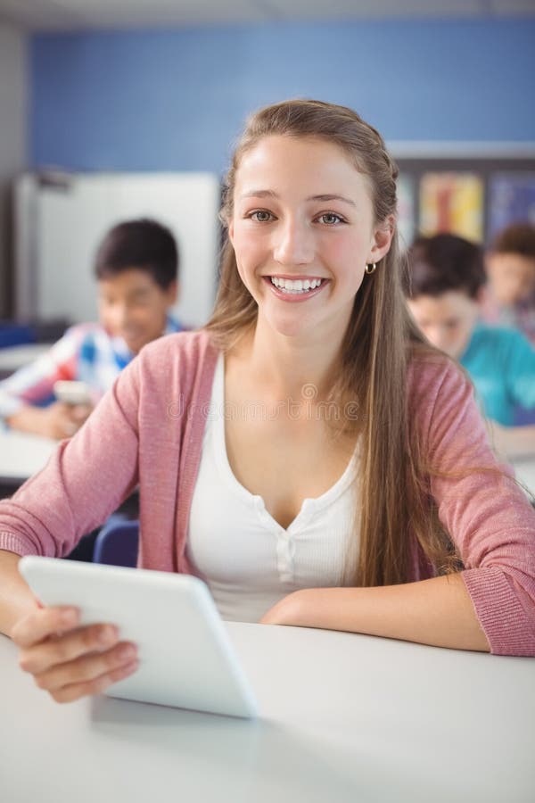 Student Holding Digital Tablet in Classroom Stock Image - Image of ...