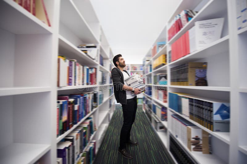 Student Holding Lot of Books in School Library Stock Image - Image of ...