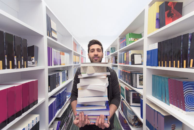 Student Holding Lot of Books in School Library Stock Image - Image of ...
