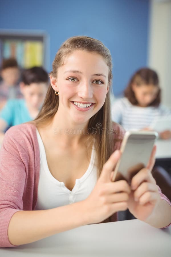 Student Holding Mobile Phone in Classroom Stock Image - Image of mobile ...
