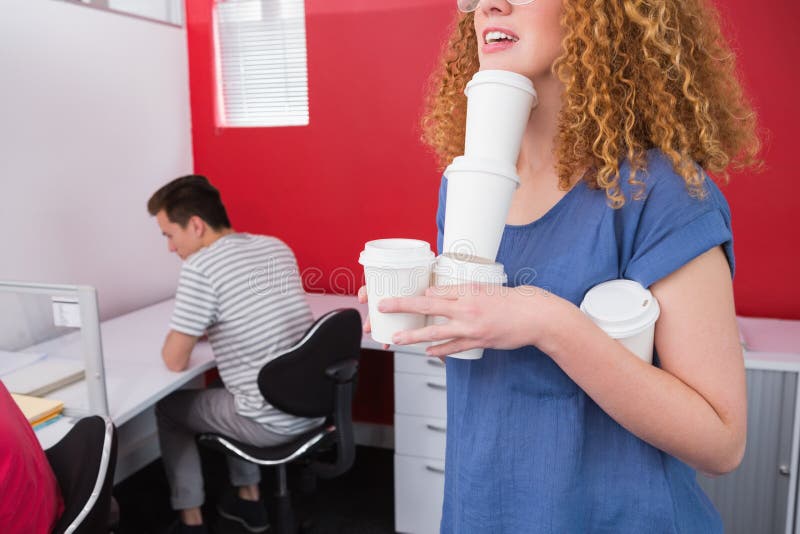 Student Holding Pile of Coffee Cup Near Classmate Stock Image - Image ...