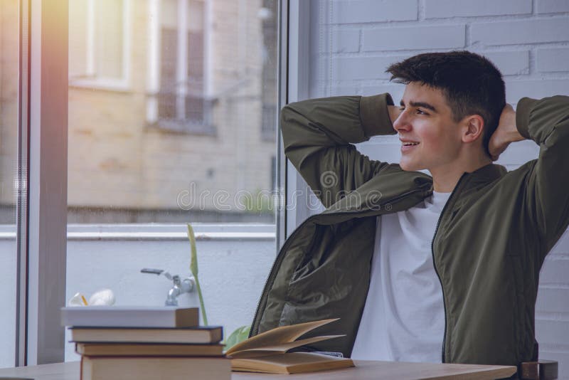 Student at home relaxed stock image. Image of sitting - 215772305
