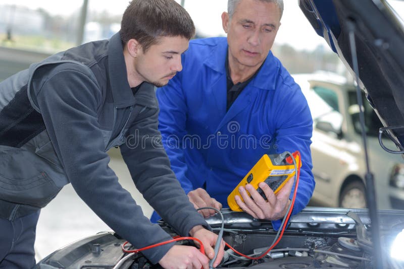 Student with Instructor Repairing Car during Apprenticeship Stock Photo ...