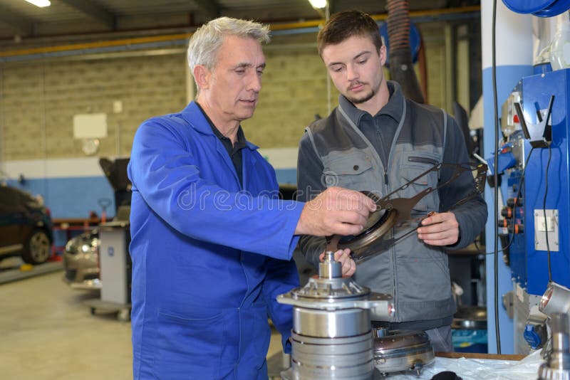 Student with Instructor Repairing Car during Apprenticeship Stock Photo ...