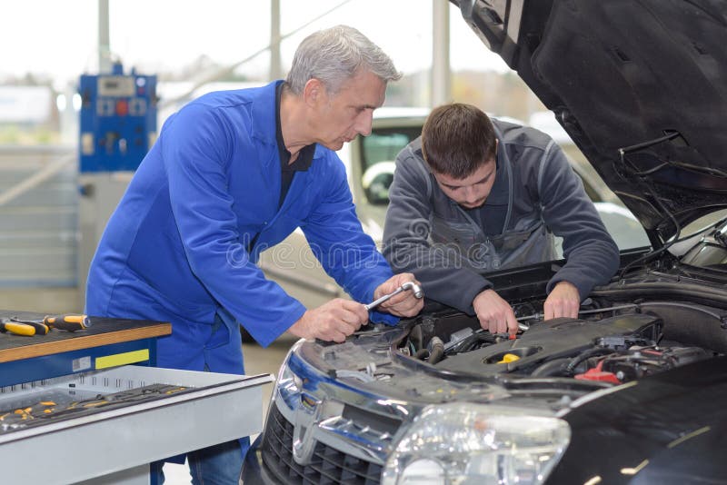 Student with Instructor Repairing Car during Apprenticeship Stock Photo ...