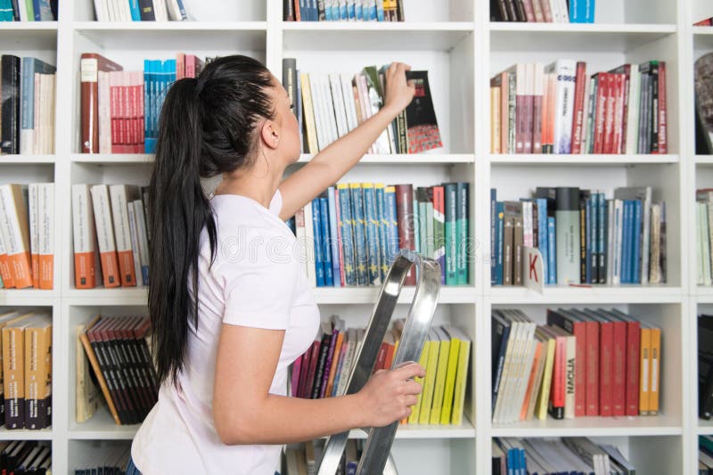 Student on Ladder in Library Stock Image - Image of woman, learning ...