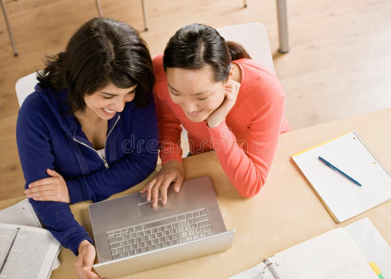 Student with Laptop Doing Homework with Friend Stock Image - Image of ...