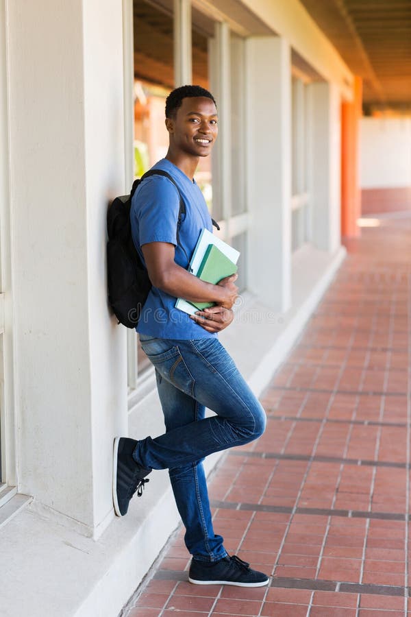 Student Leaning Against Wall Stock Image - Image of college, american ...