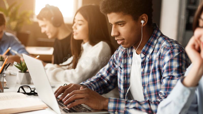 Student Learning Lessons in School Library, Using Laptop Stock Image ...