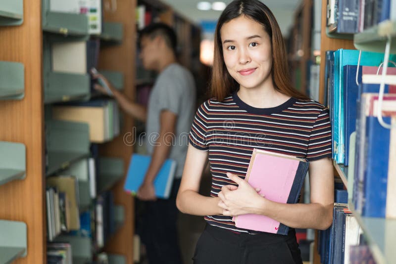 Student Learning in Library. Young Read Book in Library for Doing ...