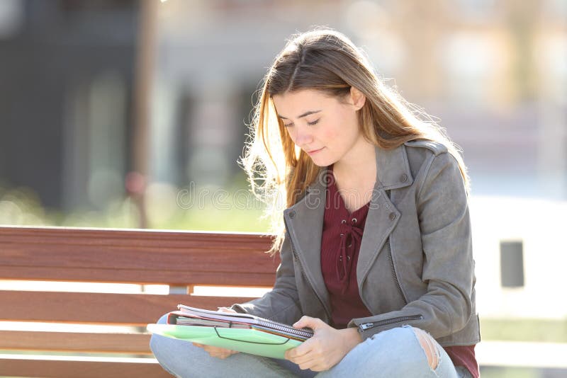 Student Learning Reading Notes on a Bench Stock Photo - Image of ...