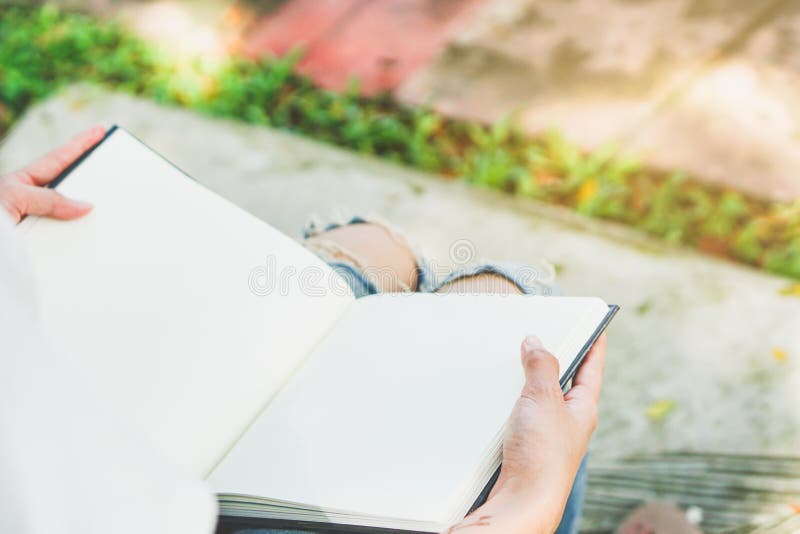 Student Learning Study Read Book Concept. Close-up Female Hand Holding ...