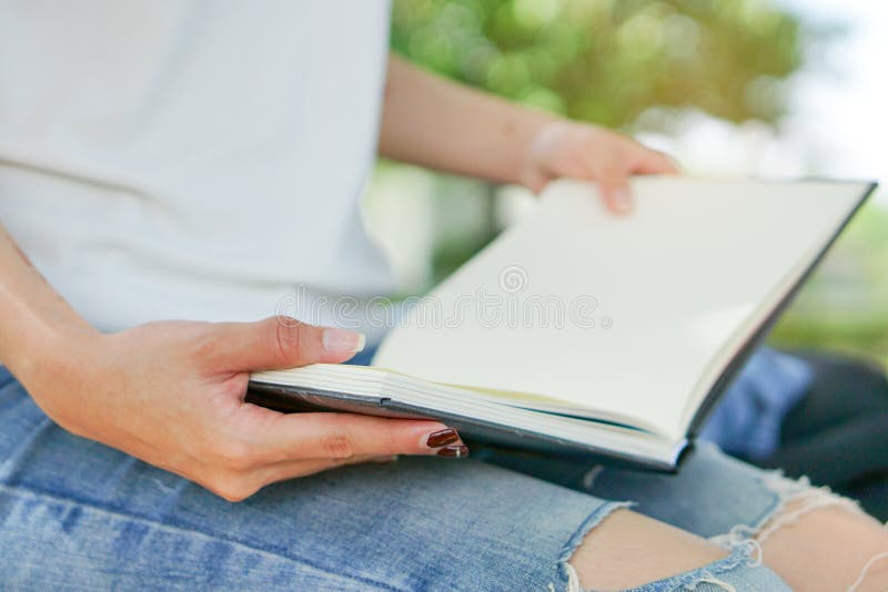 Student Learning Study Read Book Concept. Close-up Female Hand Holding ...